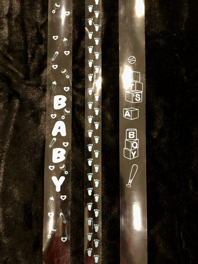 #5 CLEAR RIBBON WITH BLUE INK FOOTPRINTS 5 YARDS – Homecoming Supplies